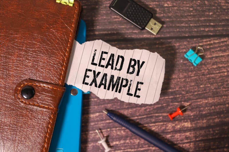 LEAD by EXAMPLE Text on a Clipboard Paper with Laptop, Mouse and Pen ...