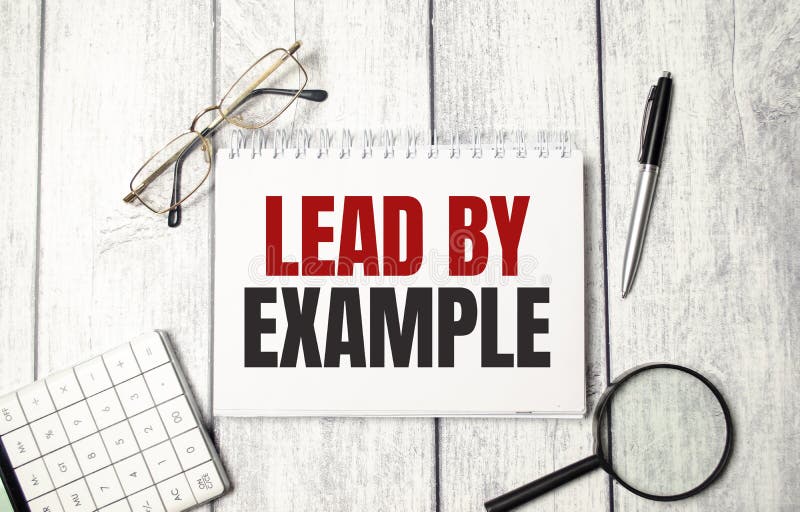 Lead by Example Words on Notepad and Pen, Calculator and Glasses Stock ...