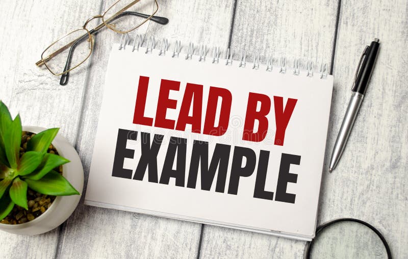 Lead by Example Words on Notepad and Pen, Calculator and Glasses Stock ...