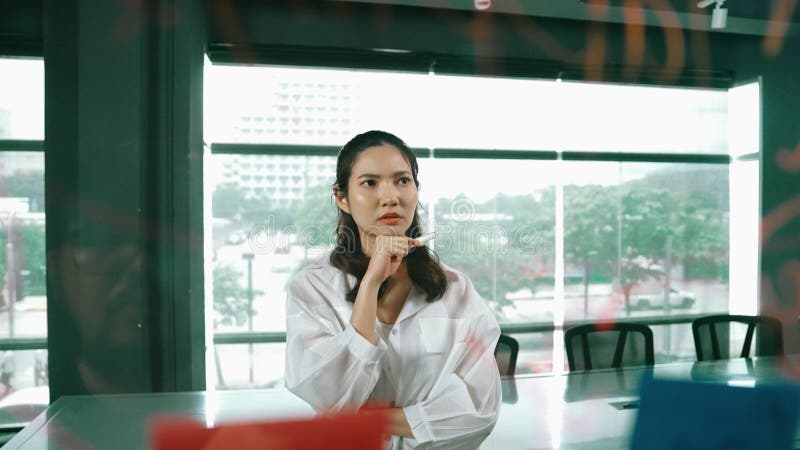 Leader Thinking about Start Up Project in Front of Glass Board ...