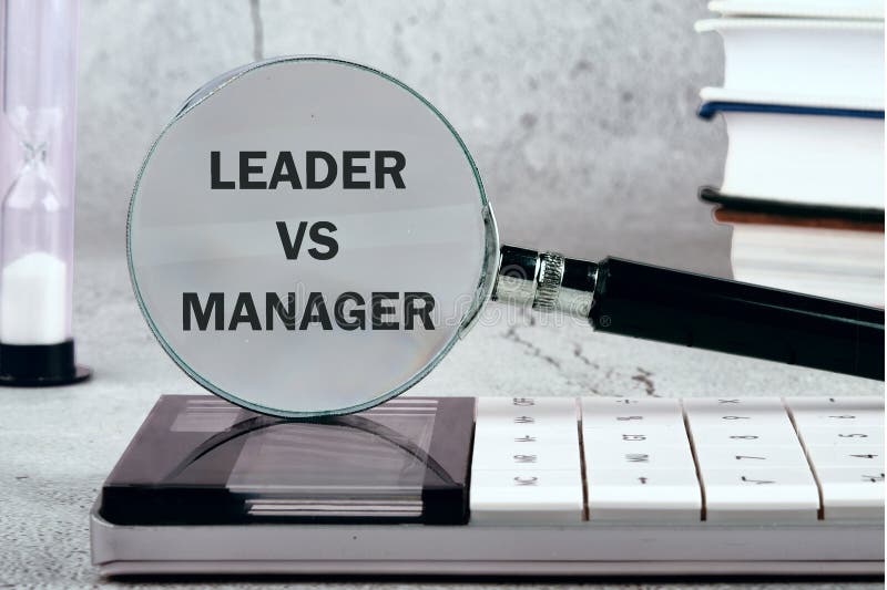 Leader Vs Manager is Shown on the Background through a Magnifying Gla ...
