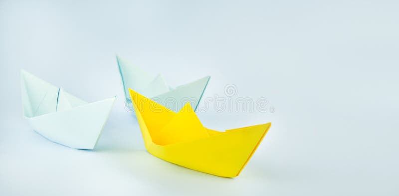 Leadership Concept. Paper Boats on a Blue Background. Business Concept ... Leadership Concept. Paper Boats on a Blue Background. Business Concept ...