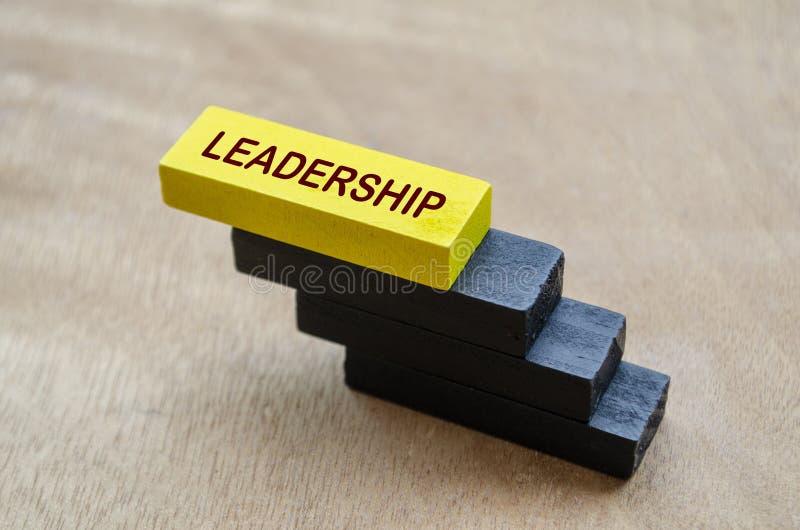Leadership Text on Yellow Wooden Block Stacking on Other Black Wooden ...