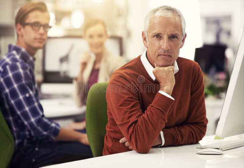 He Leads His Team by Example. Portrait of a Colleagues at Work on ...