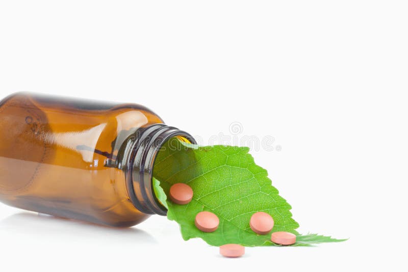 Leaf and Pills in a Small Bottle Stock Photo - Image of closeup, green ...