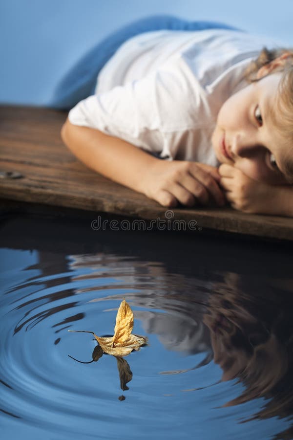 Boy Play with Leaf Ship in Water Stock Photo - Image of beauty ...