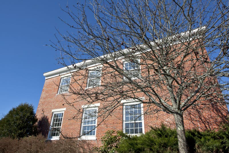 Leafless Apple Tree in Front of Old Brick Building. Stock Photo - Image ...