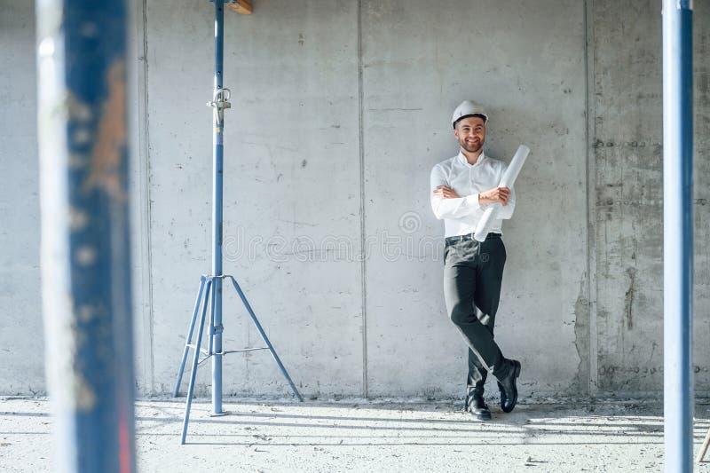 Leaning on the Wall. Holding Paper with Project Plan Stock Photo ...