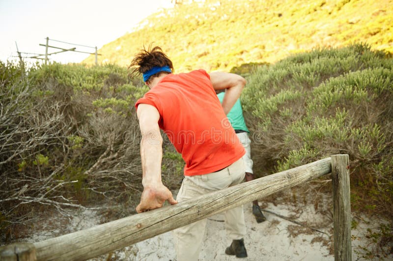 Leaping Over the Obstacles Put before Them. Young Men Going through an ...