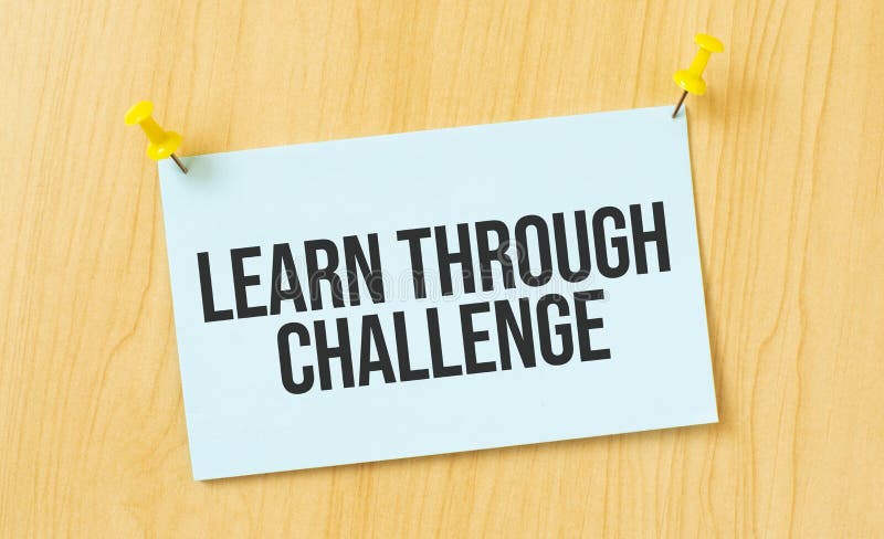 Learn through Challenge Sign Written on Sticky Note Pinned on Wooden ...