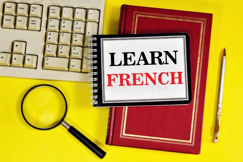 Learn French.- Writing Text in a Notebook on a Textbook Stock Image ...
