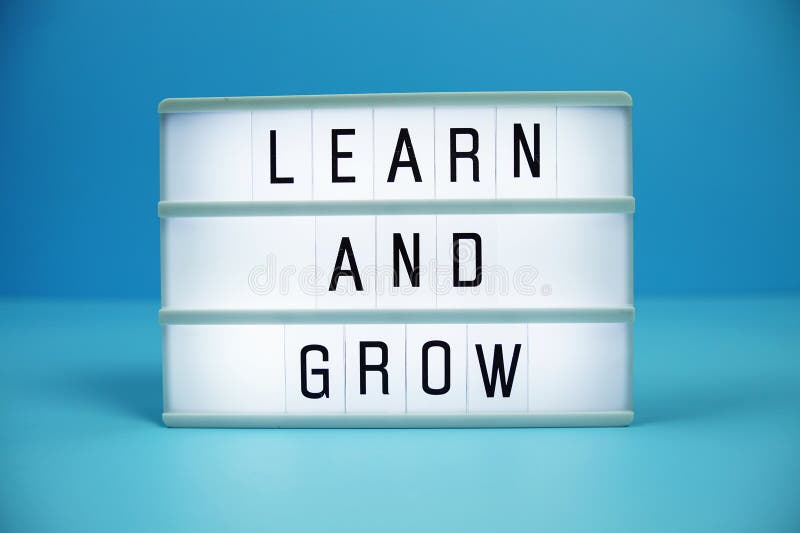 Learn and Grow Letterboard Text on LED Lightbox on Blue Background ...