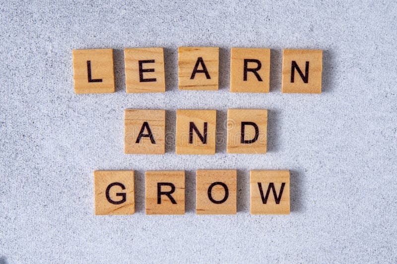 Learn and Grow Phrase Made of Wooden Letters. Word Stock Image - Image ...