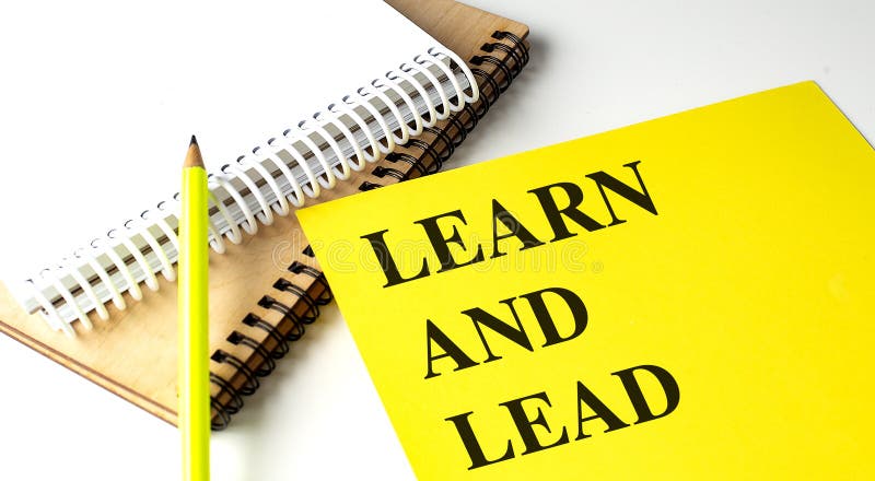 LEARN and LEAD Text on Yellow Paper with Notebooks Stock Image - Image ...