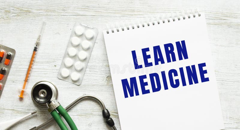 LEARN MEDICINE is Written in a Notebook on a White Table Next To Pills ...
