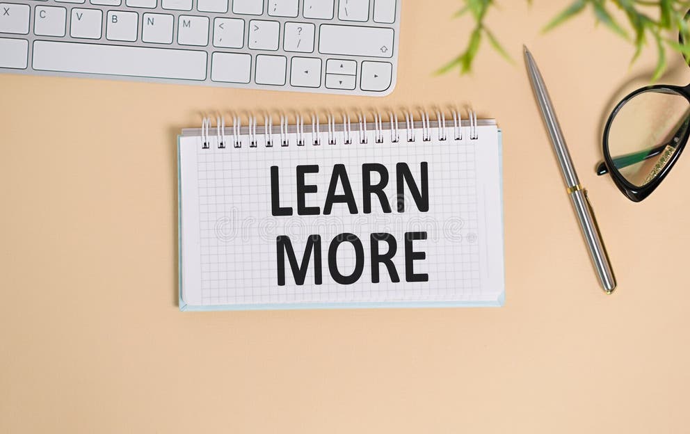 LEARN MORE Text on Notebook with Pen on Yellow Table Stock Photo ...