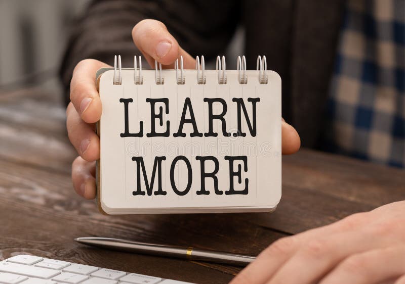 Learn More Text Written on a Notebook in Hand, Business Concept. Stock ...