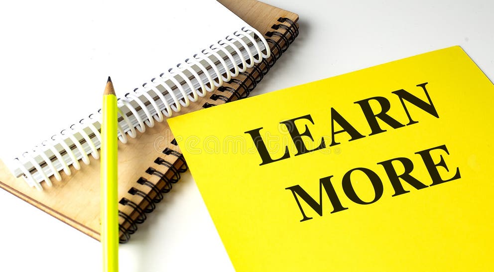 LEARN MORE Text on Yellow Paper with Notebooks Stock Image - Image of ...