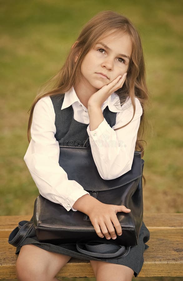 Learn To Think. Serious Child with Thoughtful Look. Small Pupil Lost in ...