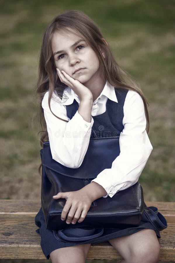 Learn To Think. Serious Child with Thoughtful Look. Small Pupil Lost in ...