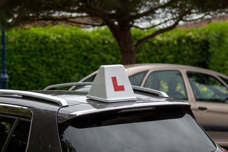 A Learner Driver Sign on the Roof of the Car of a Driving School Stock ...