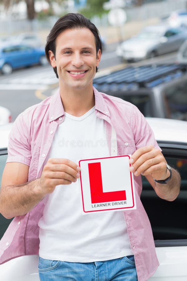 Learner Driver Smiling and Holding L Plate Stock Image - Image of ...