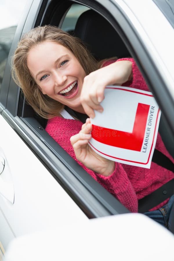 Learner Driver Smiling and Holding L Plate Stock Photo - Image of plate ...