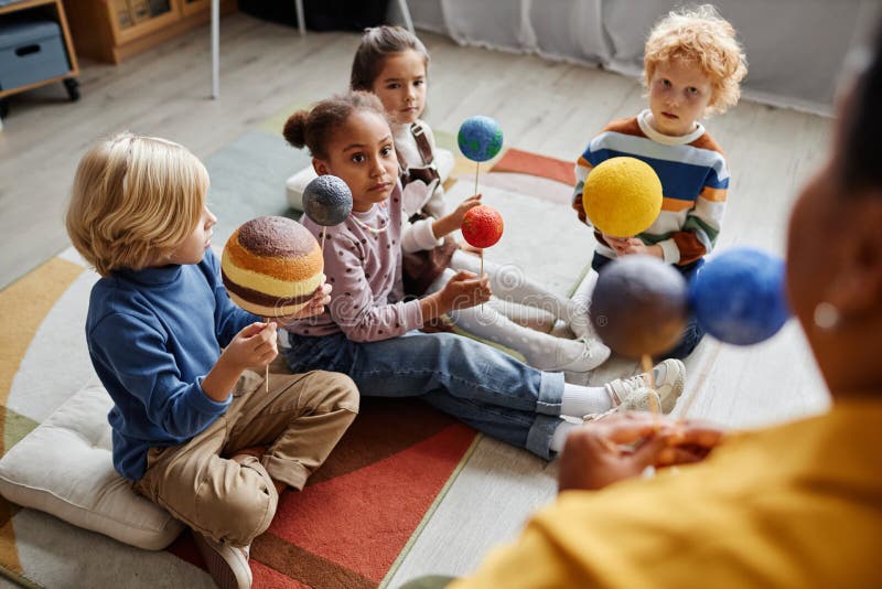 Learners of Primary School Holding Models of Solar System Planets Stock ...