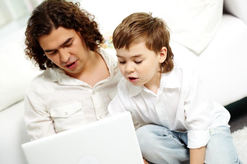Father and Son on Computer Together Stock Image - Image of campus ...