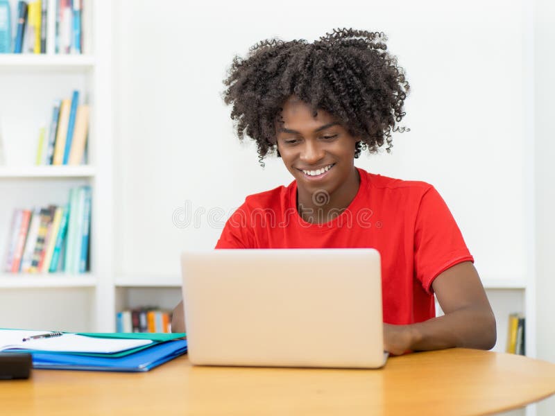 Learning African American Female Student at Computer with Group of ...