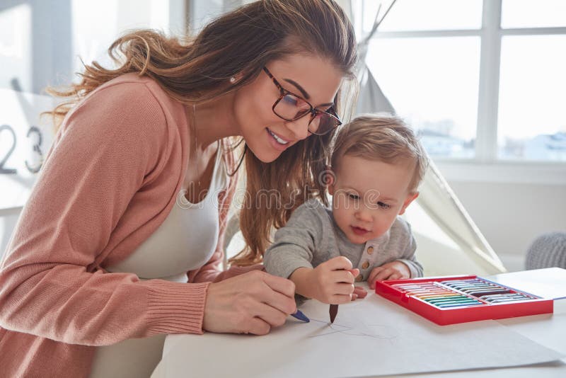 Learning about Colours by Making Scribbles. a Woman and Her Young Son ...