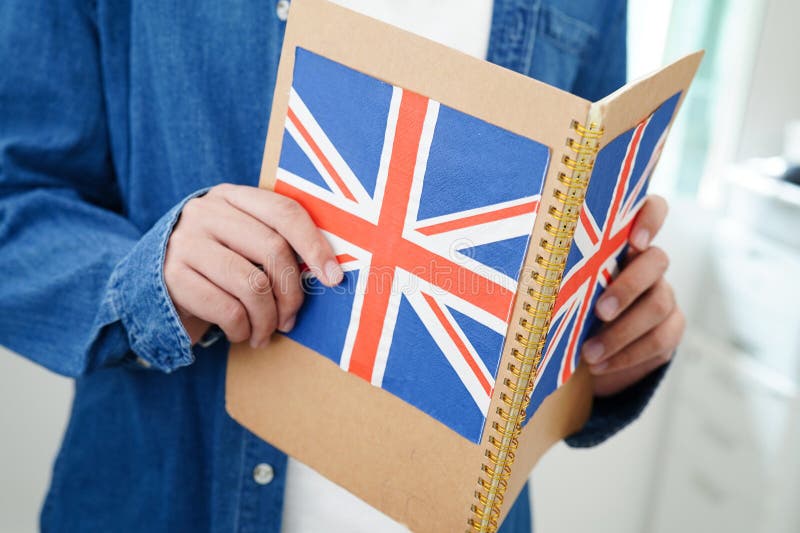 Learning English, Asian Teenage Student Holding Book with Flag for ...