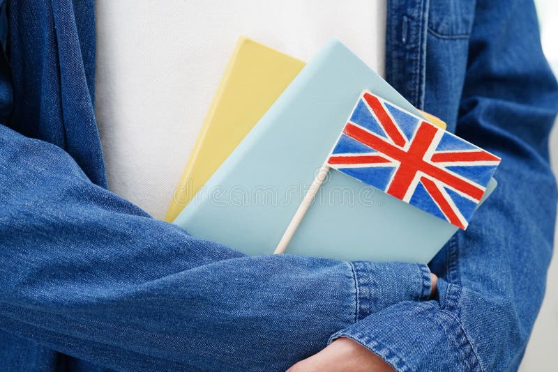 Learning English, Asian Teenage Student Holding Book with Flag for ...