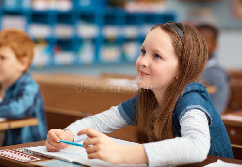 Learning Excites Her. an Elementary School Girl Working in Class. Stock ...