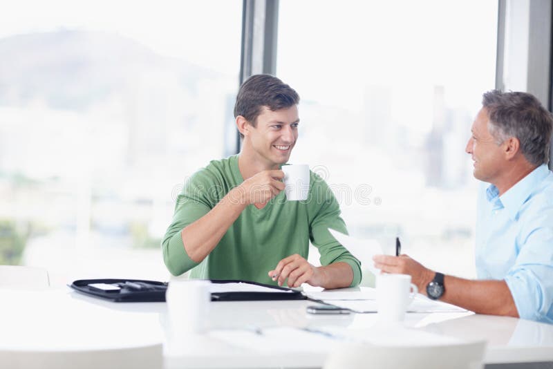 Learning from Experience. a Young Office Worker Discussing Ideas with ...