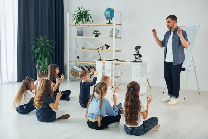Learning Gesture Language. Group of Children Students in Class at ...