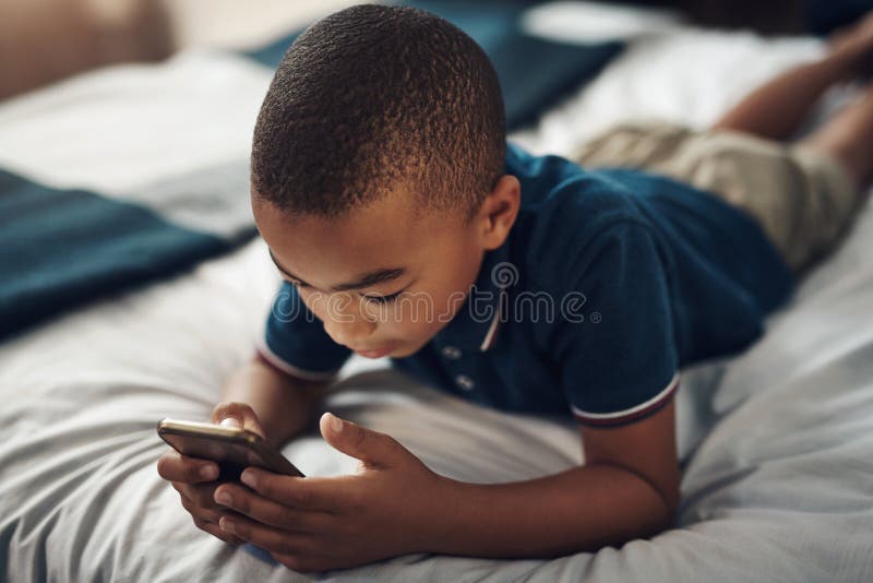 Learning is a Lot More Fun through Educational Games. a Young Boy Using ...