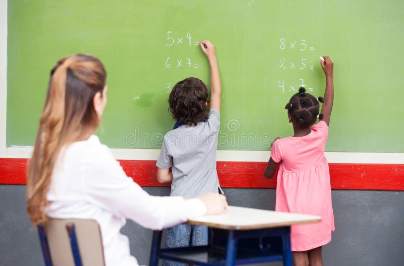 Learning Mathematics at Elementary School. Multi Ethnic Students Stock ...
