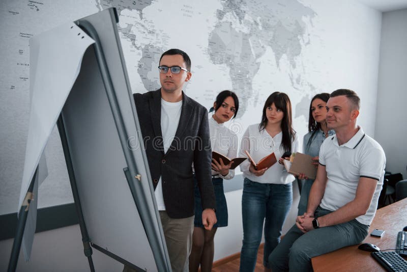 Learning New Stuff. Business People and Manager Working on Their New ...