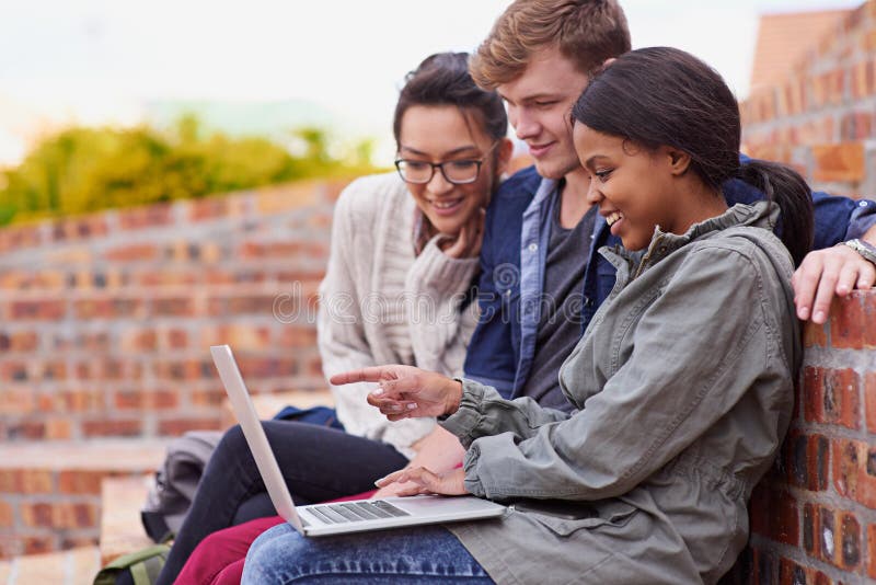 Learning is Pleasurable. a Group of Students Sitting Outside while on ...