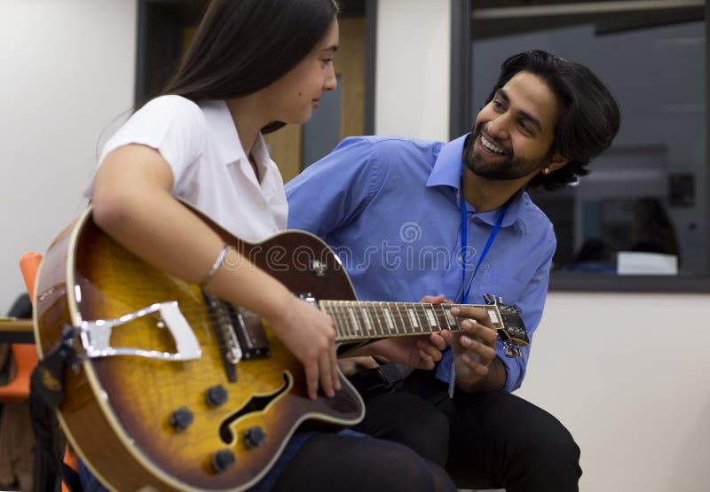 Learning the Strings stock image. Image of high, people - 72543837