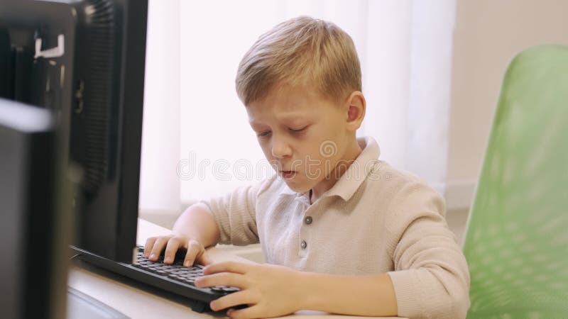 Schoolboy Using Computer in a Class Stock Video - Video of desk, happy ...