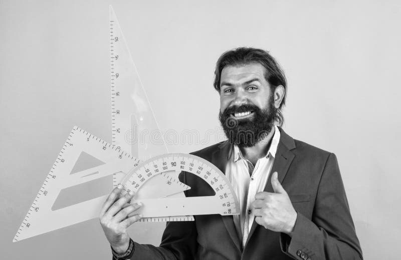 Learning the Subject. Happy Man with Beard Use Triangle and Protractor ...
