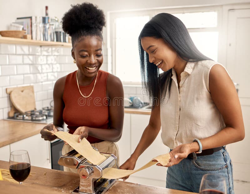 Learning To Cook Together. Two Young Friends Cooking Together at Home ...