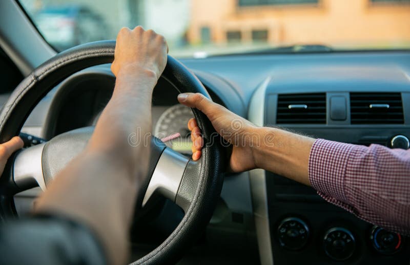 Learning To Drive. Close Up of. Two Young Men in a Driving Session ...