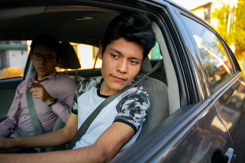 Learning To Drive. Two Young Men in a Driving Session Stock Image ...
