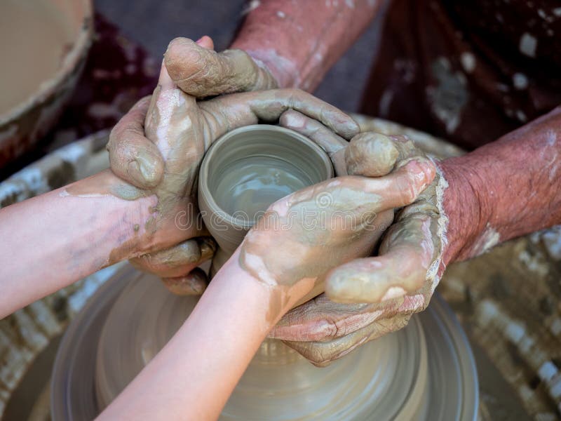 Learning to make clay pots stock photo. Image of finger - 314258068