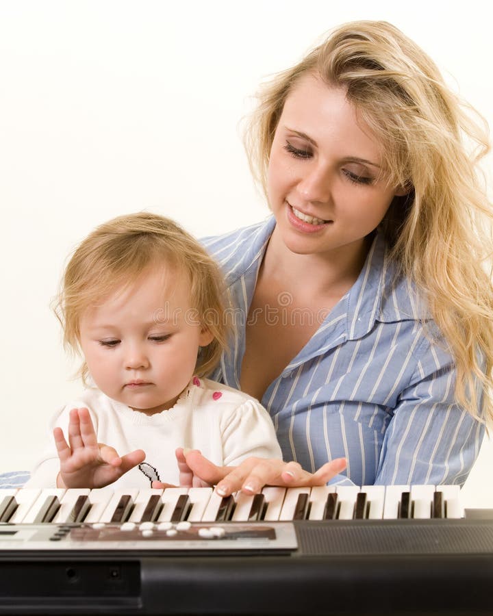 Learning to play keyboard stock photo. Image of lesson - 4058292