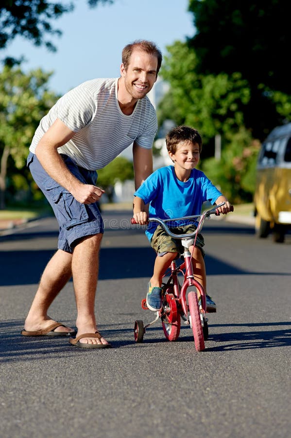 Learning to ride a bike stock image. Image of bicycle - 34708659