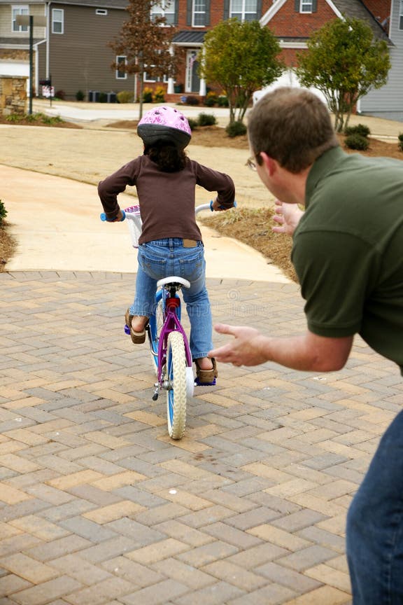 Learning To Ride a Bike stock image. Image of elementary - 5016015